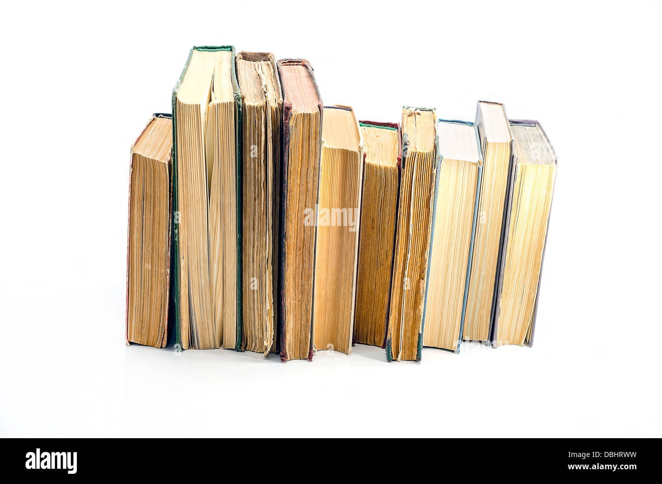 Stack of old books isolated on the light background Stock Photo - Alamy