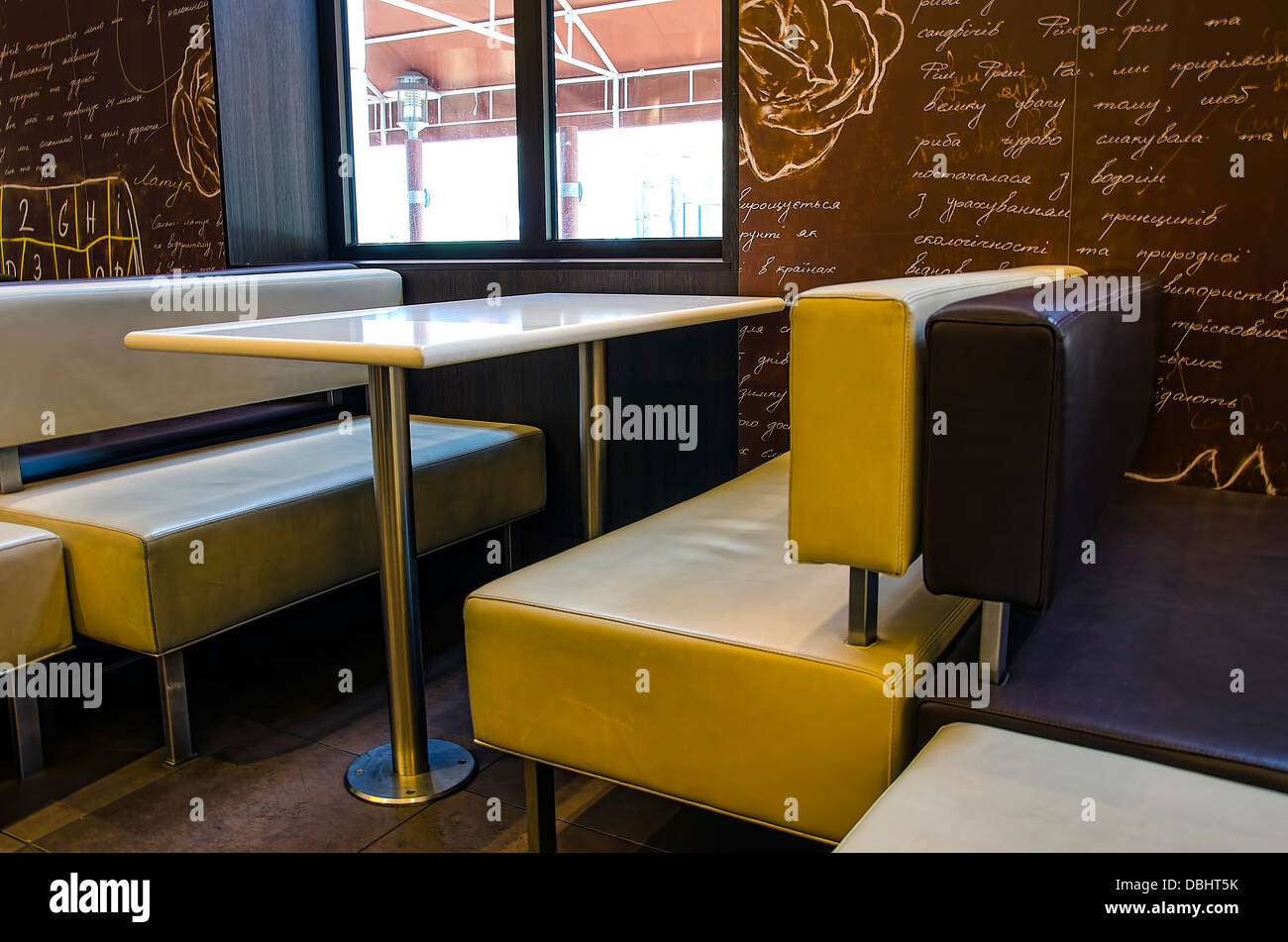 Empty restaurant interior in brown and white tones Stock Photo - Alamy