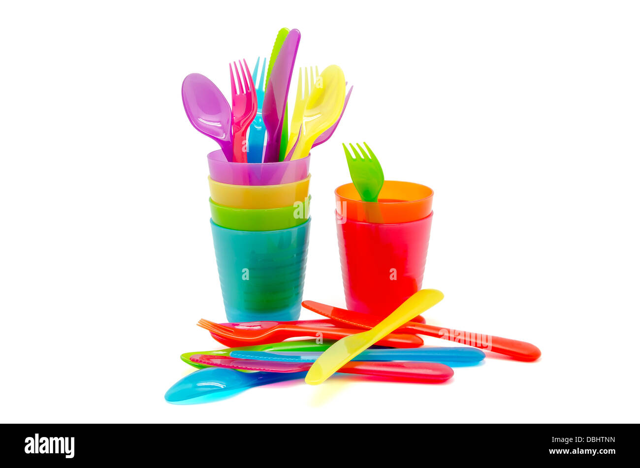Plastic tableware of various colors on white background Stock Photo - Alamy