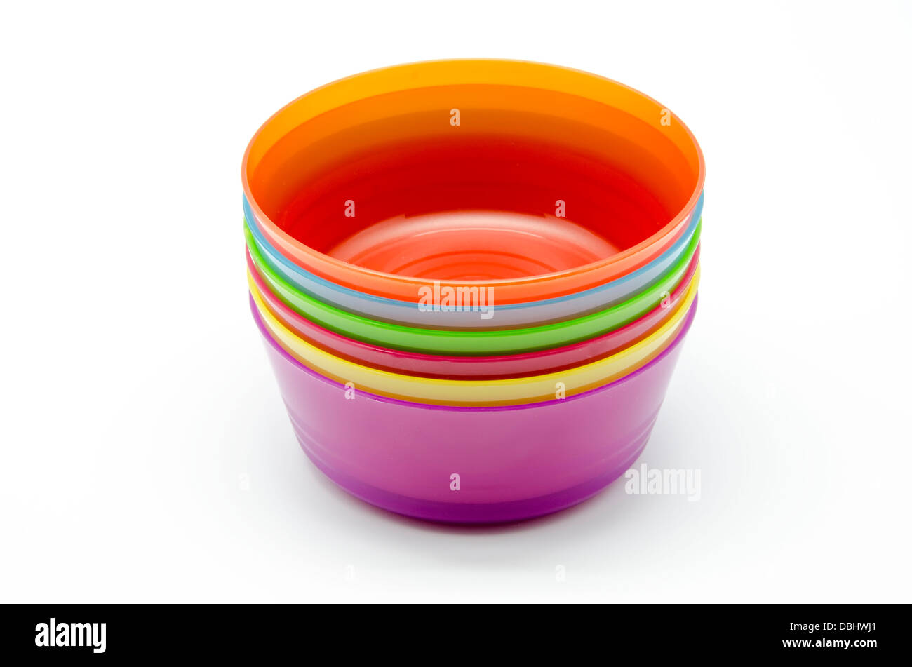 Plastic tableware of various colors on white background Stock Photo - Alamy