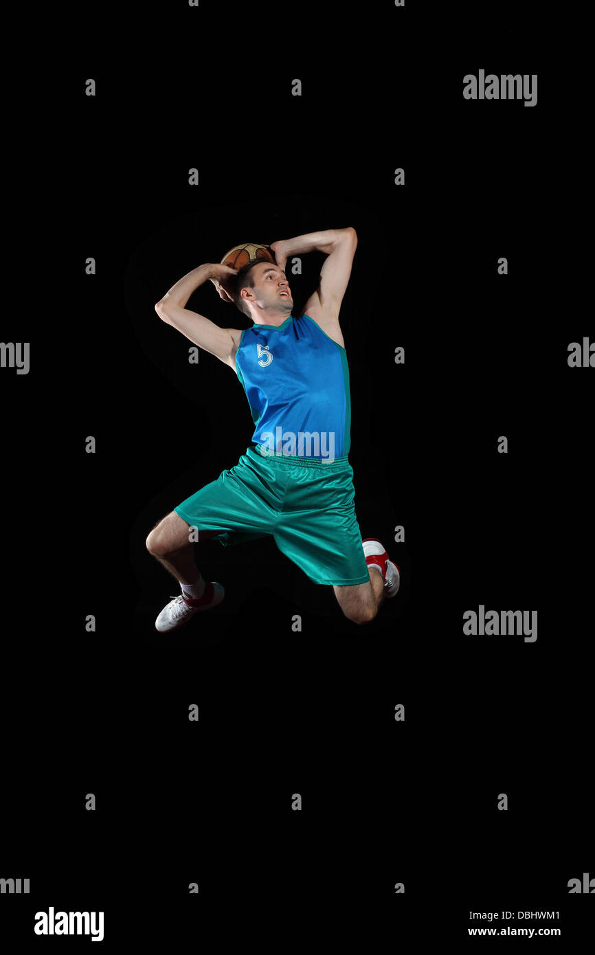 Basketball player with a ball Stock Photo - Alamy