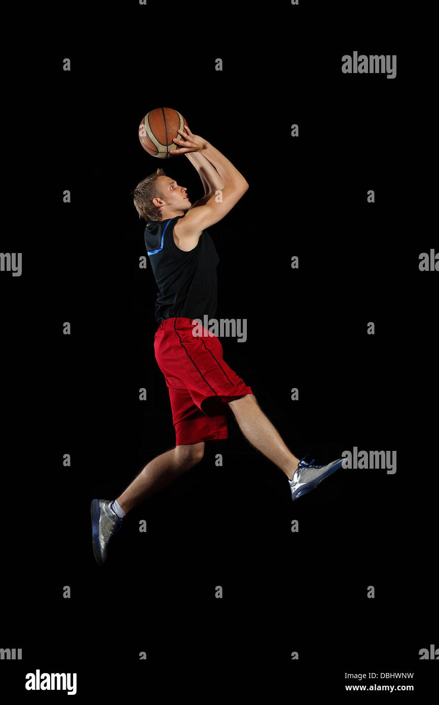 Basketball player with a ball Stock Photo - Alamy