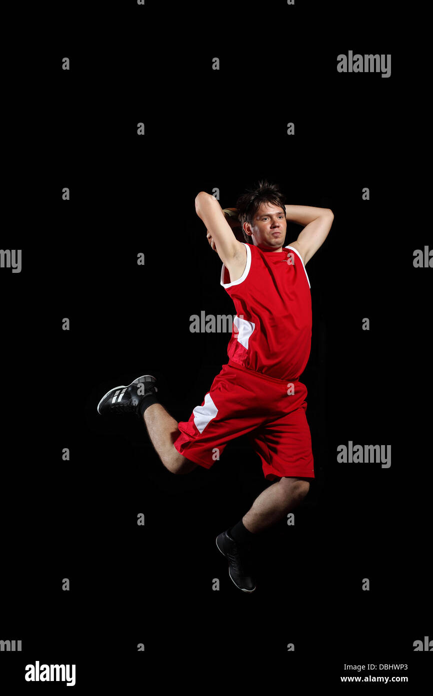 Basketball player with a ball Stock Photo - Alamy