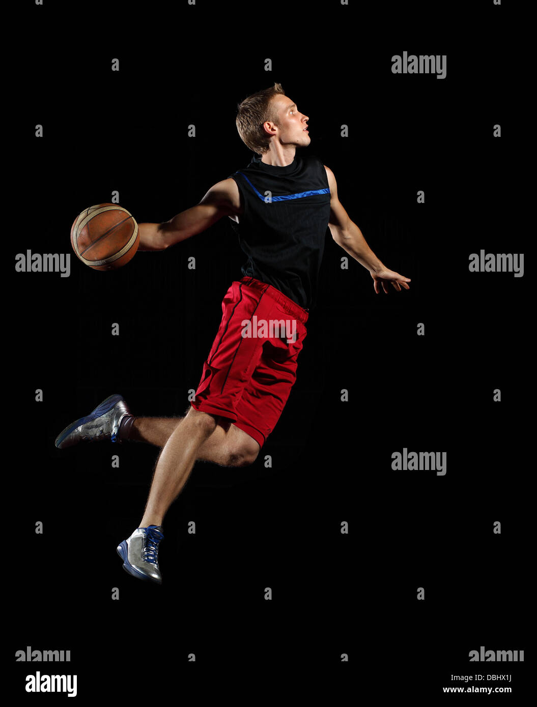 Basketball player with a ball Stock Photo - Alamy
