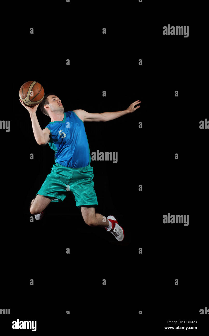 Basketball player with a ball Stock Photo - Alamy