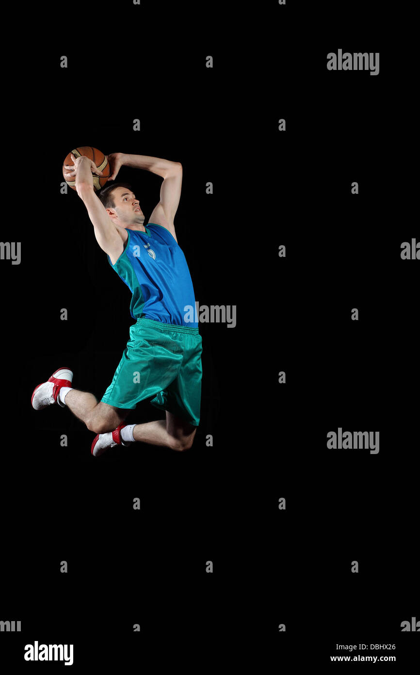 Basketball player with a ball Stock Photo - Alamy