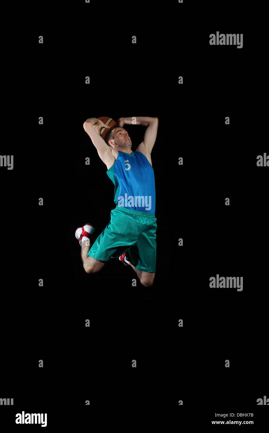 Basketball player with a ball Stock Photo - Alamy
