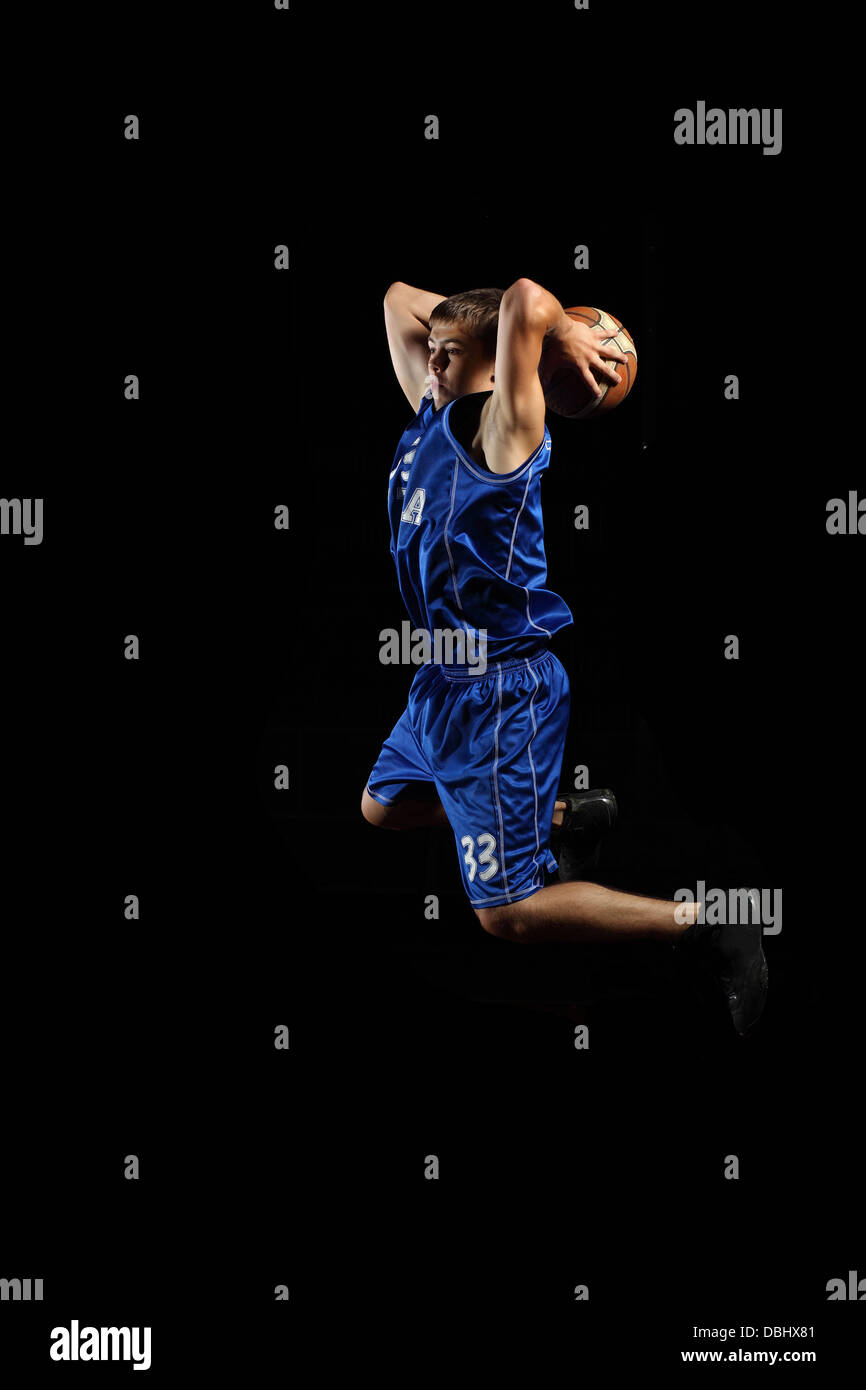 Basketball player with a ball Stock Photo - Alamy