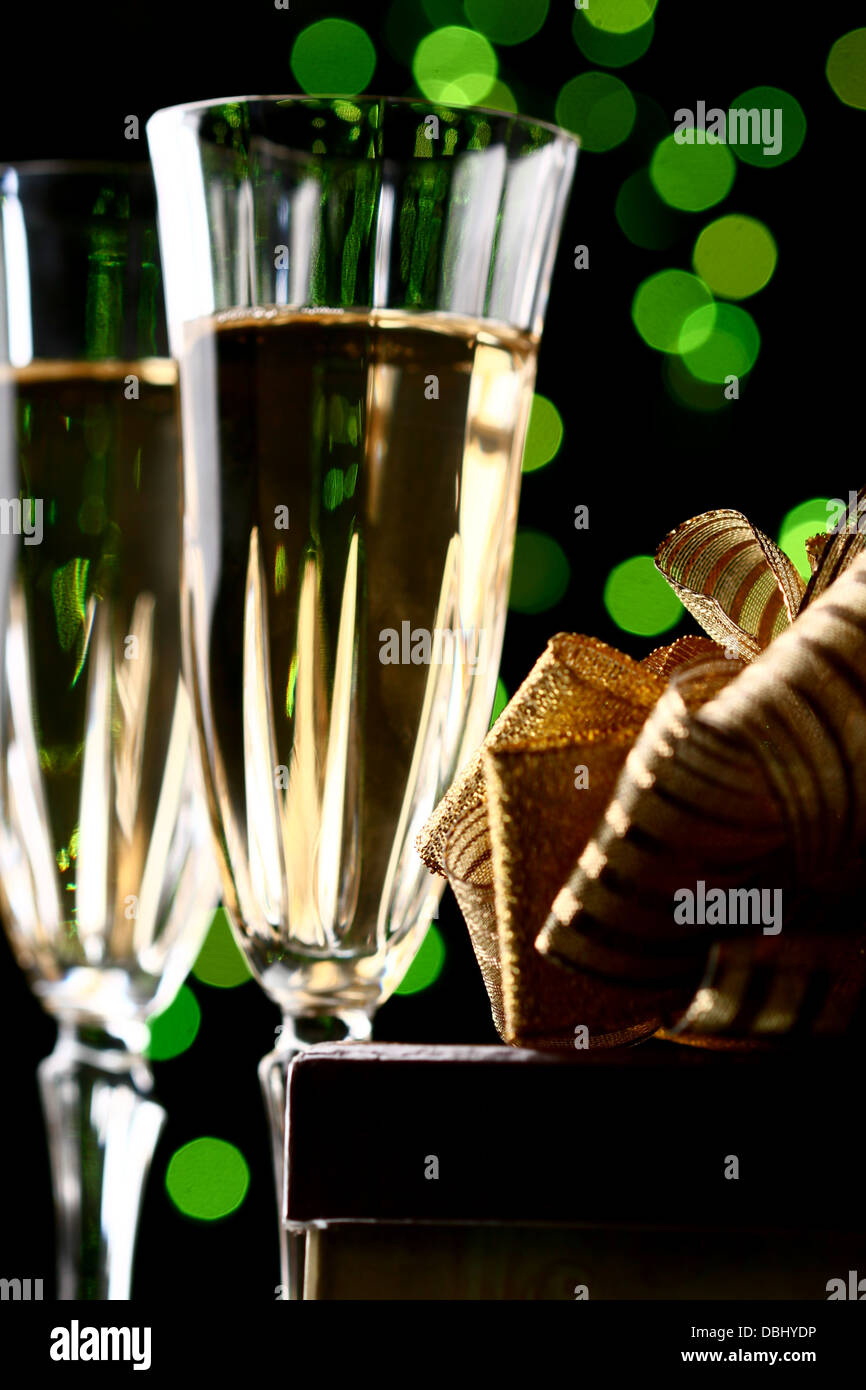 holiday card golden champagne and gift Stock Photo - Alamy