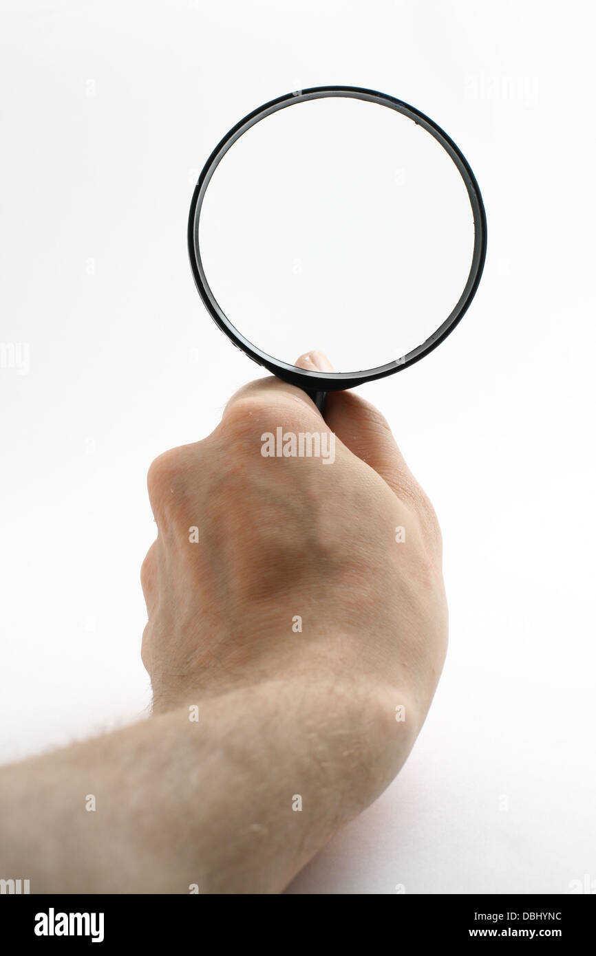 magnifier in men hand isolated Stock Photo - Alamy