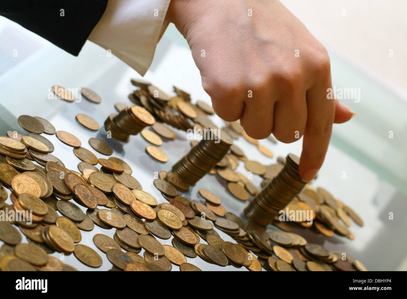 hand make coins piles on white Stock Photo - Alamy
