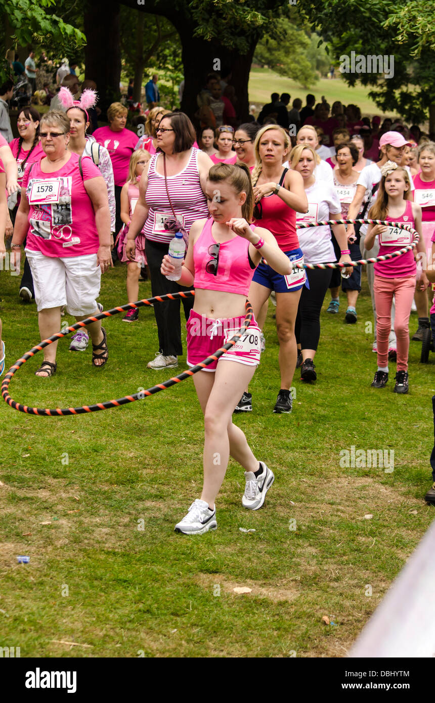 Women doing the hula hooping at a race for life Stock Photo - Alamy
