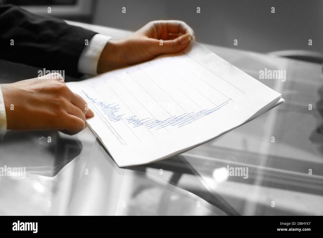 read the graph in financial report Stock Photo - Alamy