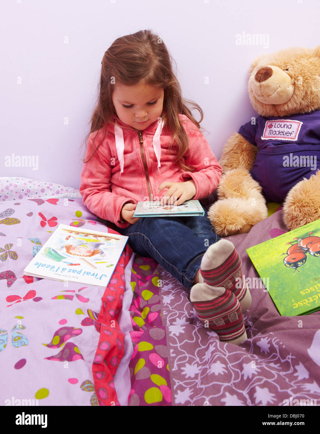 CHILD READING INDOORS Stock Photo - Alamy