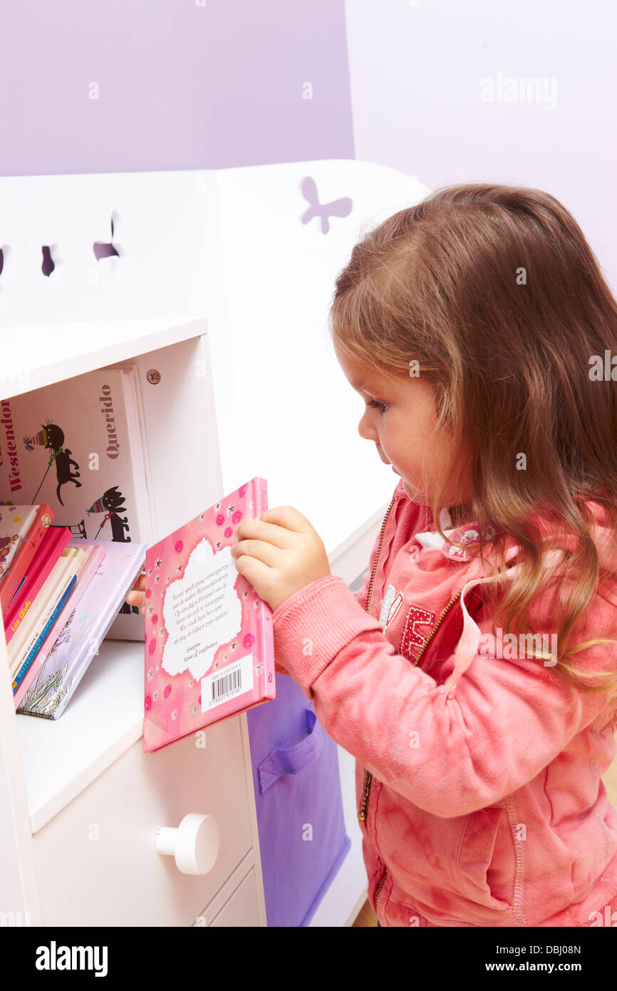 CHILD READING INDOORS Stock Photo - Alamy