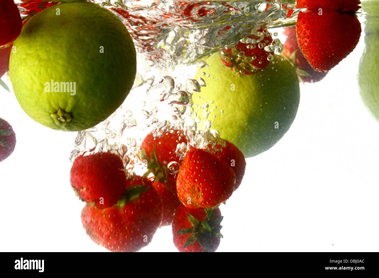 lime splash isolated on white background Stock Photo - Alamy