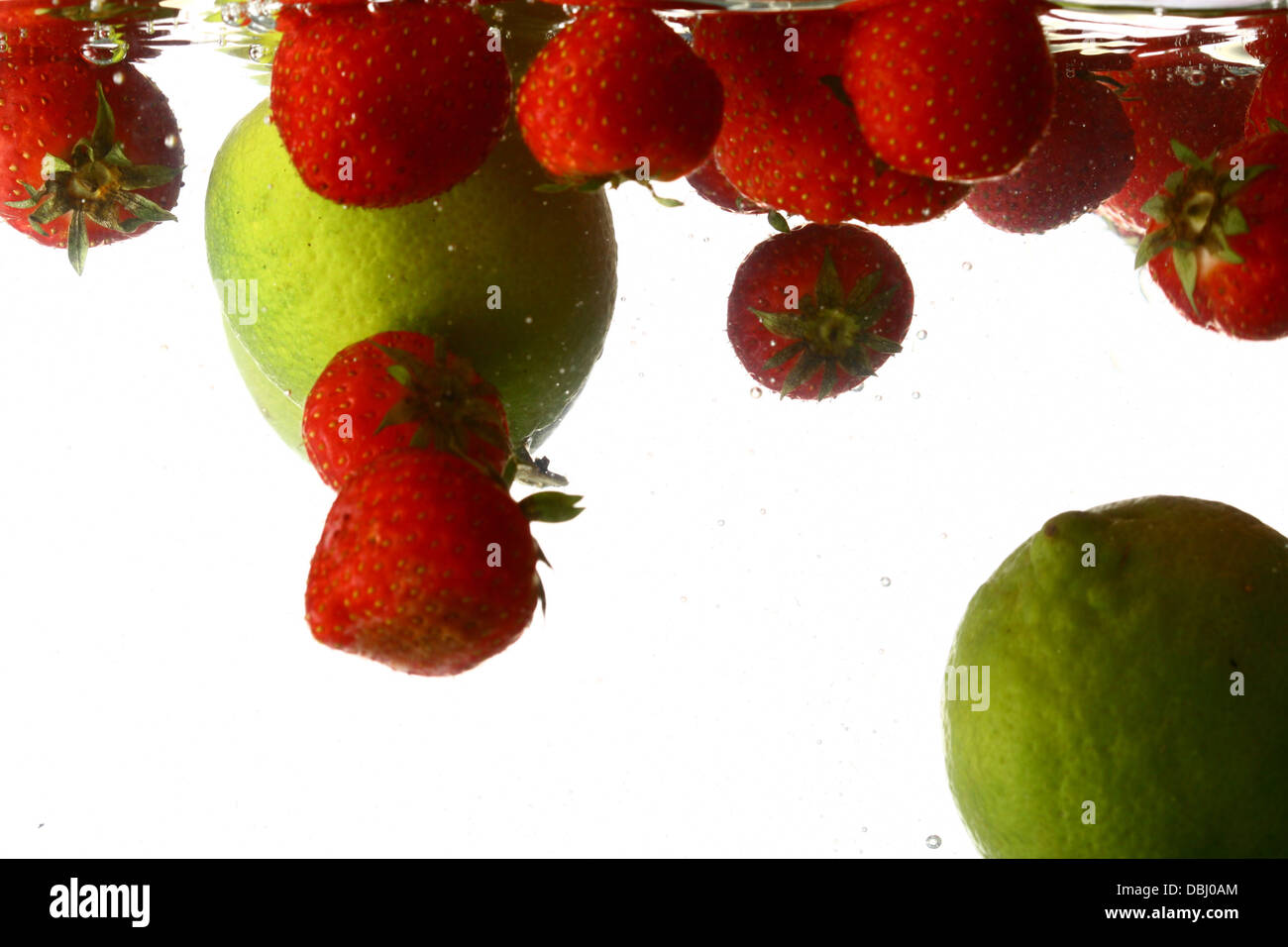 lime splash isolated on white background Stock Photo - Alamy