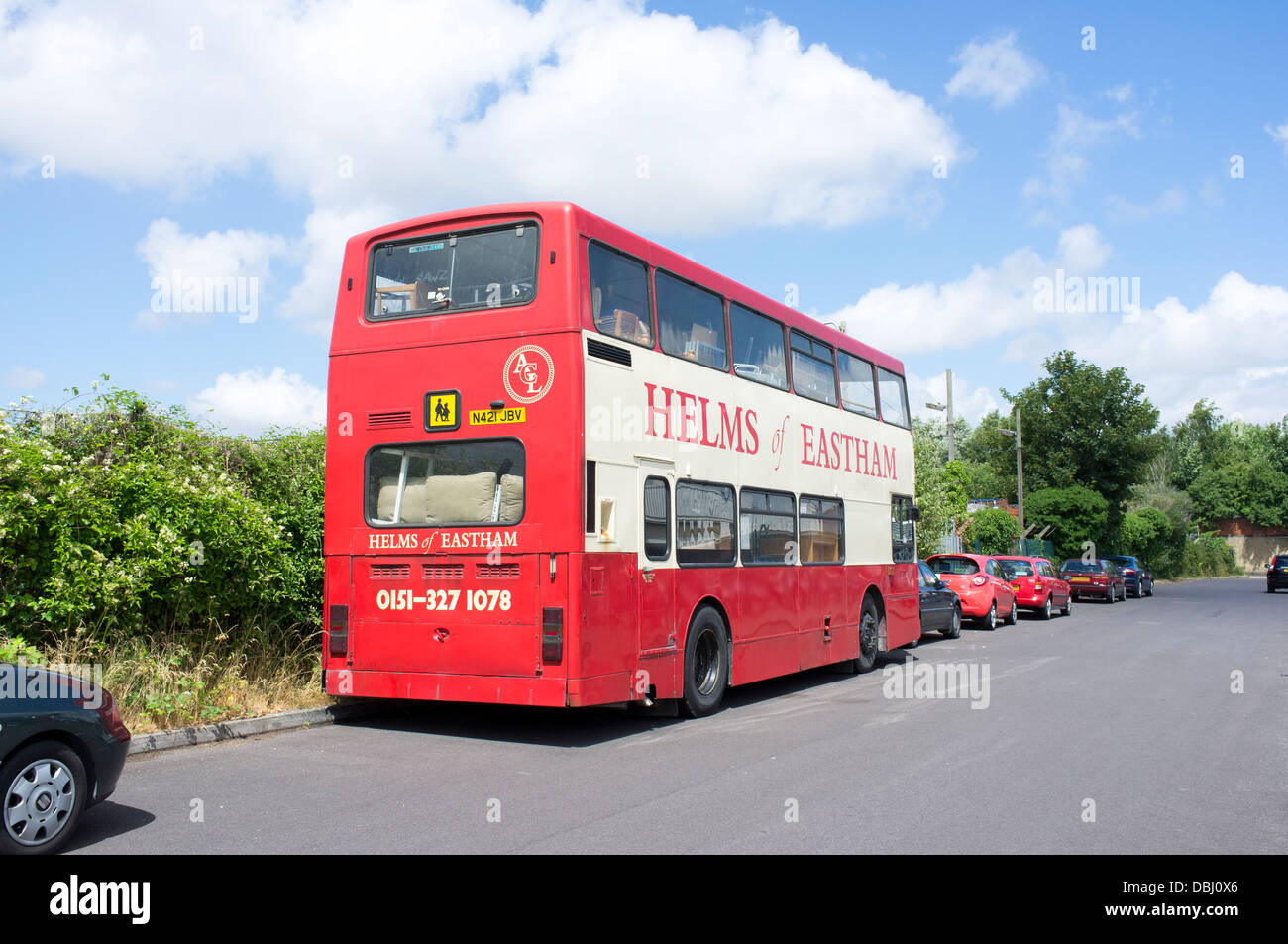 British double decker bus converted to private use parked at the side ...