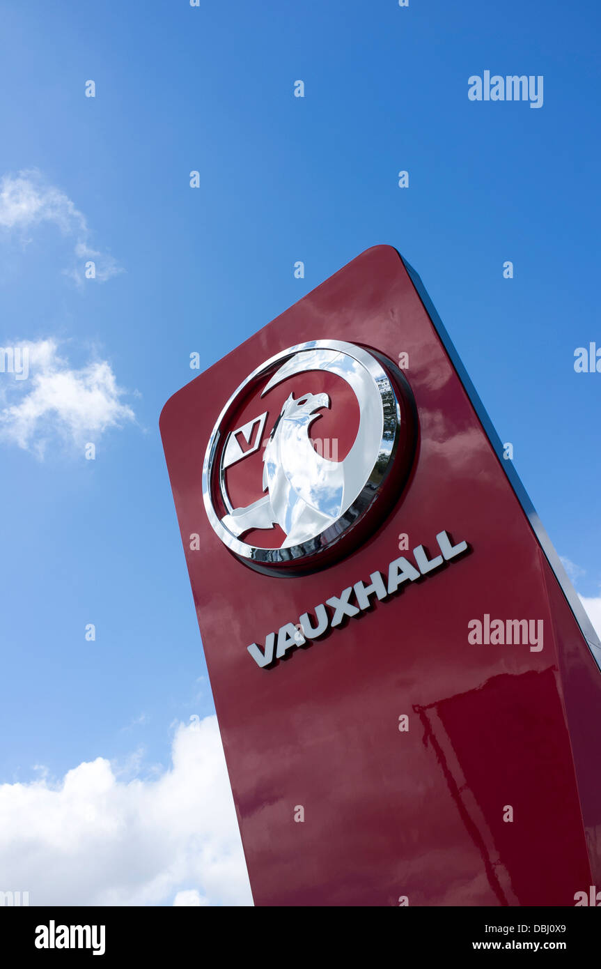 Looking up at Vauxhall car sign and logo with blue sky behind Stock ...