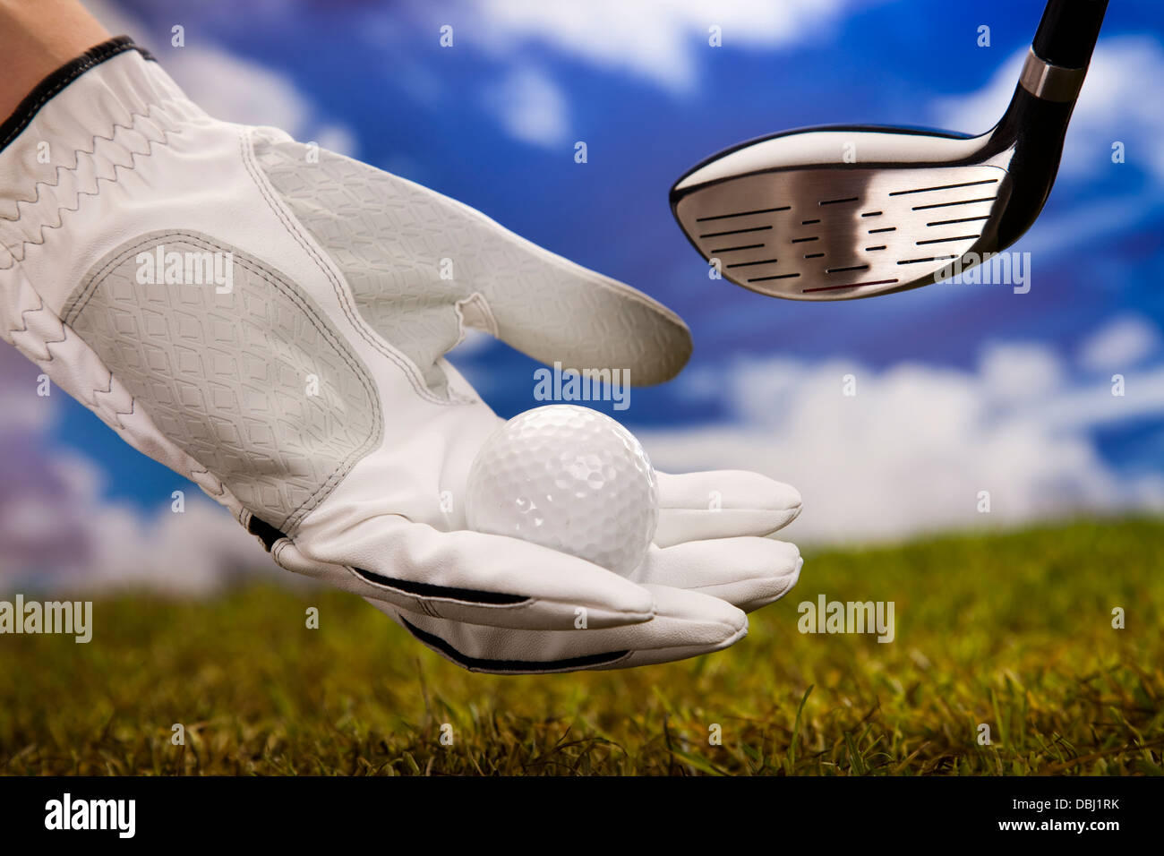 Hand and golf ball Stock Photo - Alamy