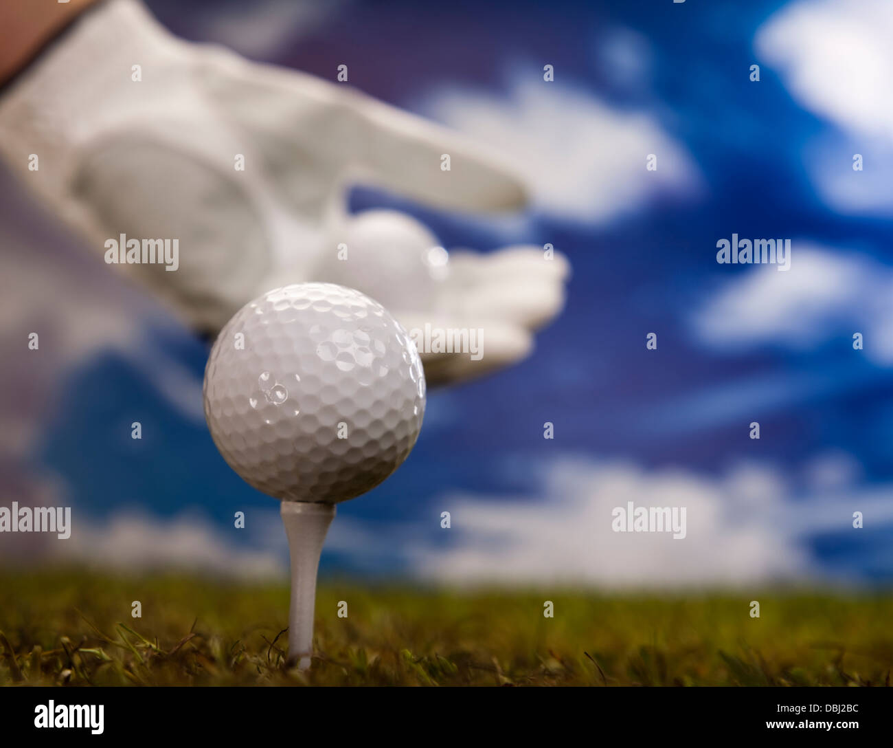 Hand and golf ball Stock Photo - Alamy