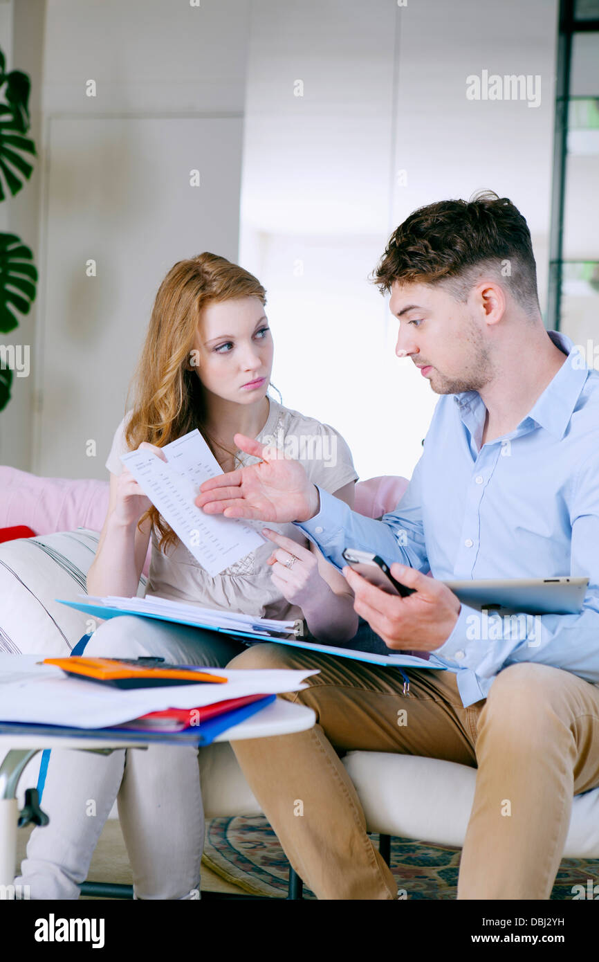 COUPLE DOING PAPERWORK Stock Photo - Alamy