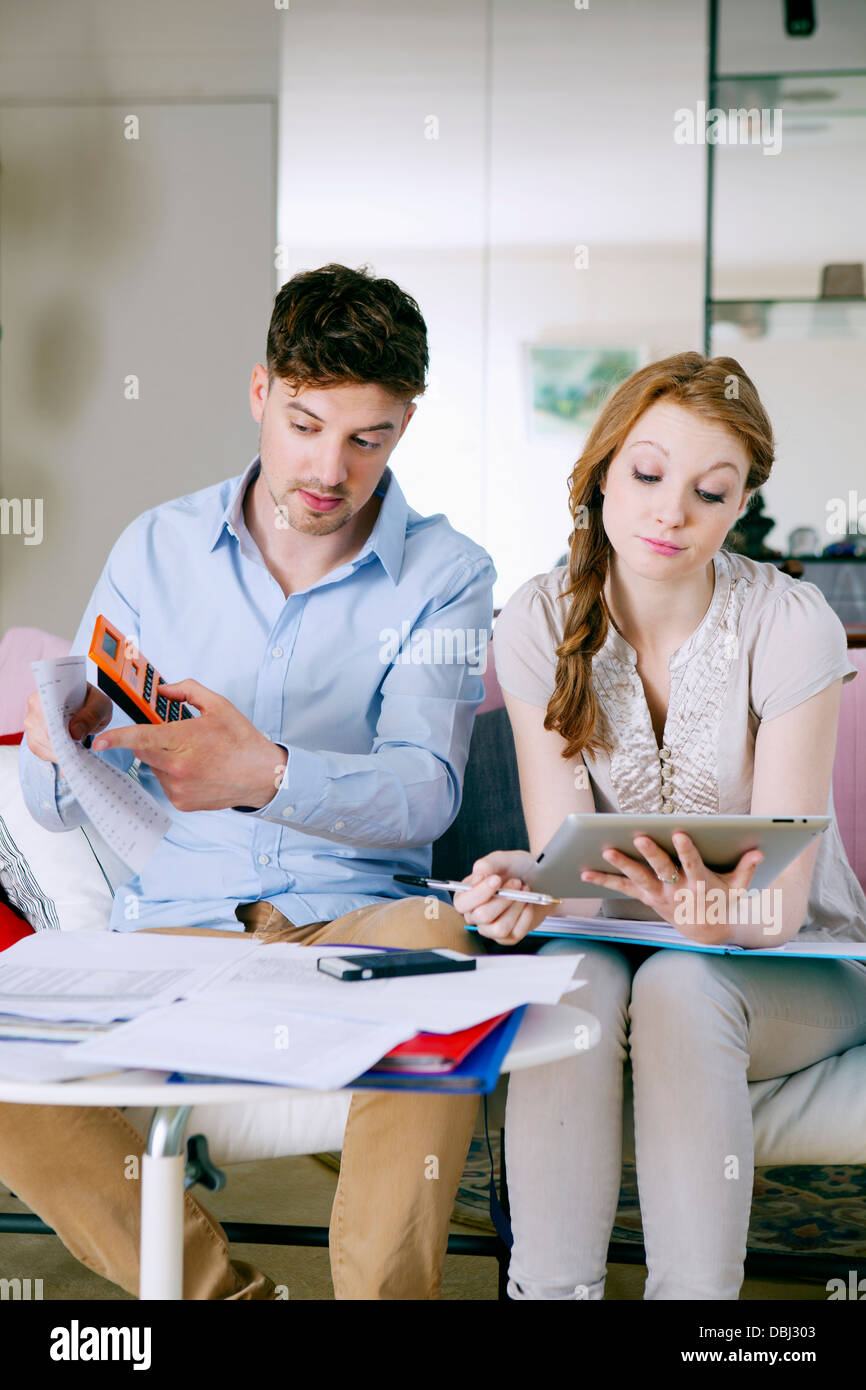 COUPLE DOING PAPERWORK Stock Photo - Alamy