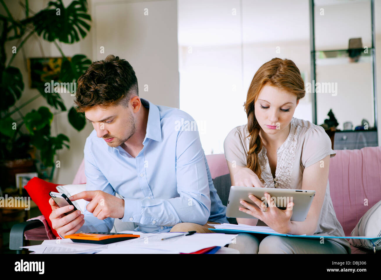 COUPLE DOING PAPERWORK Stock Photo - Alamy