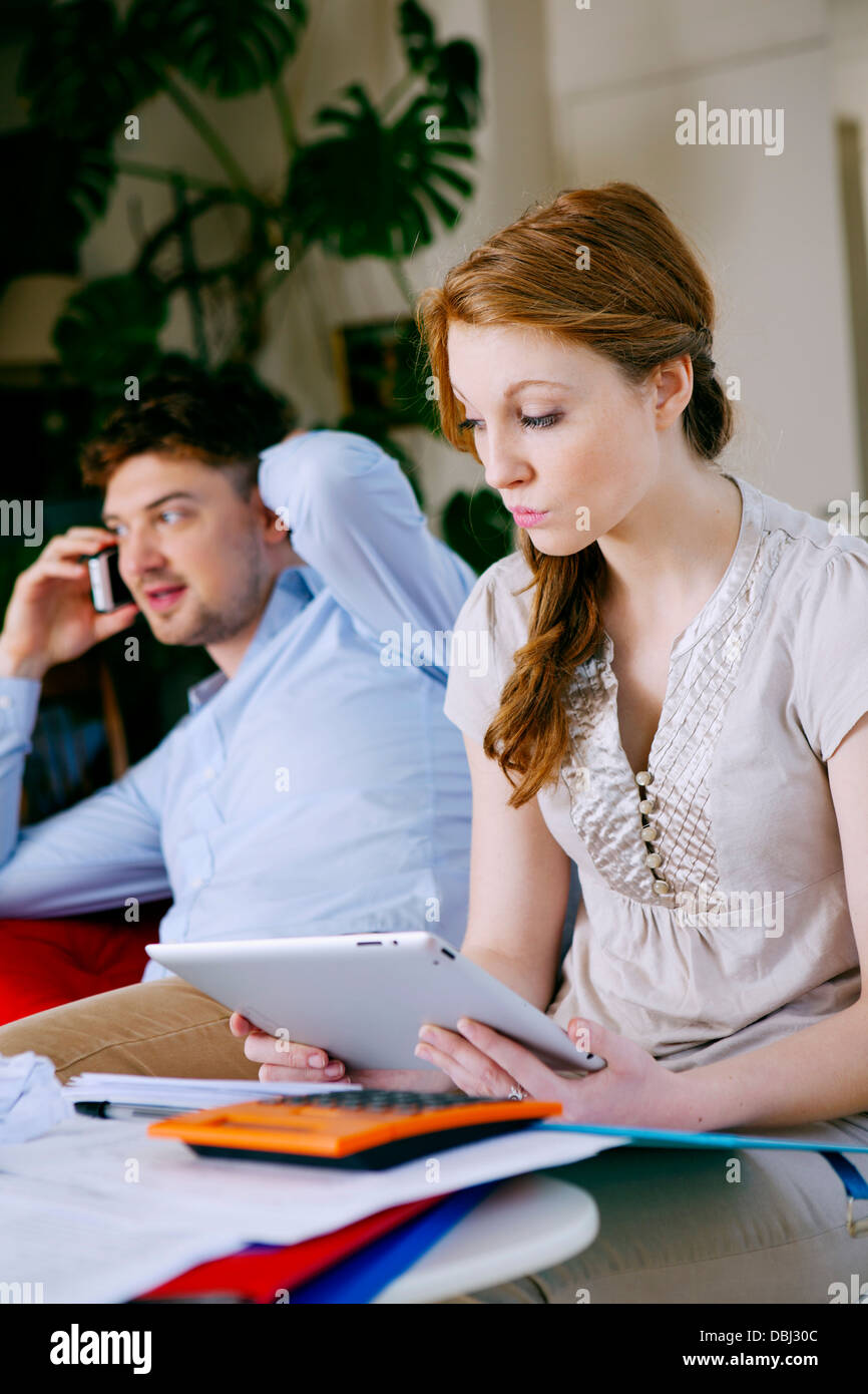 COUPLE DOING PAPERWORK Stock Photo - Alamy