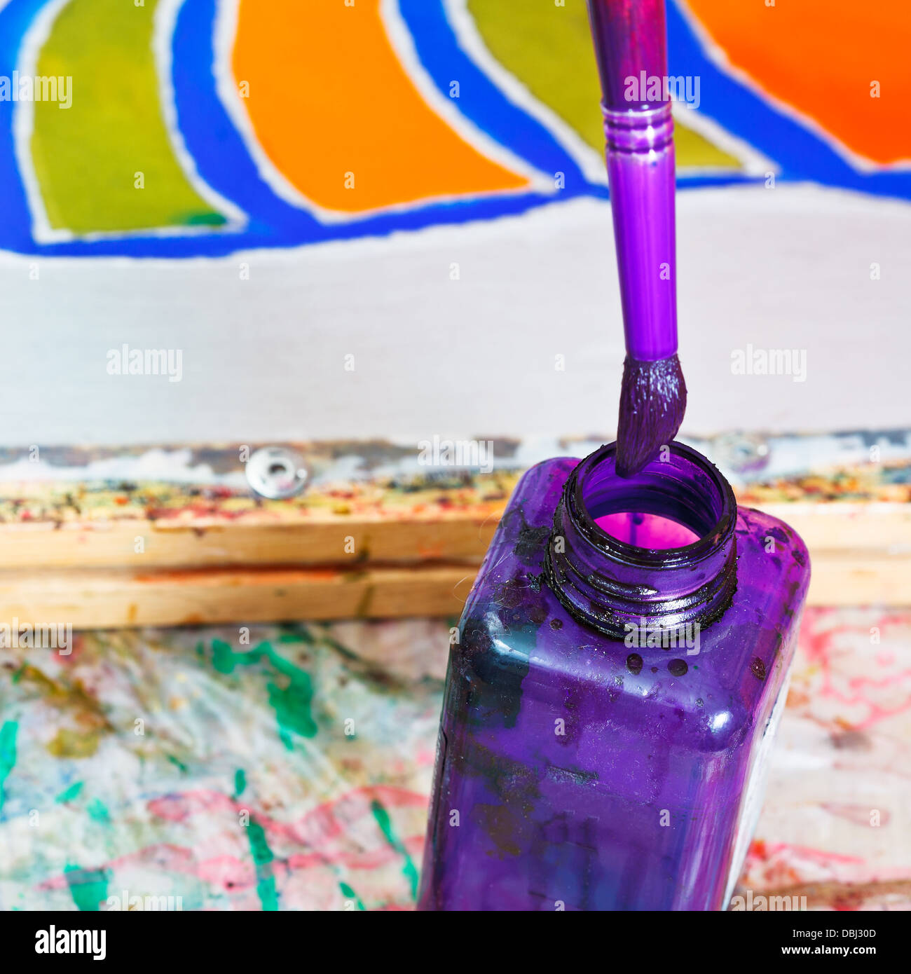brush in bottle with dye for cold batik painting Stock Photo - Alamy