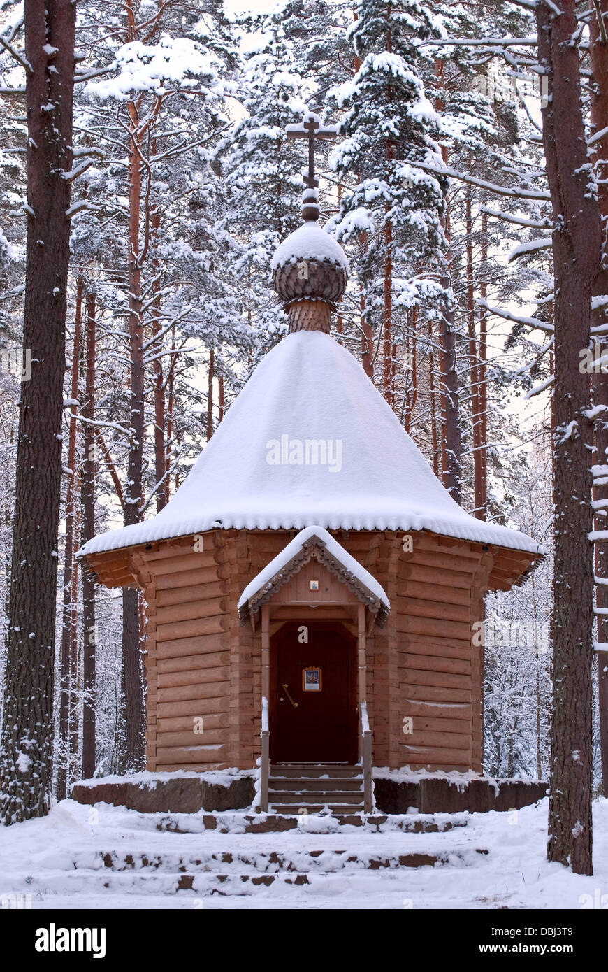 Wooden chapel in winter forest Stock Photo - Alamy