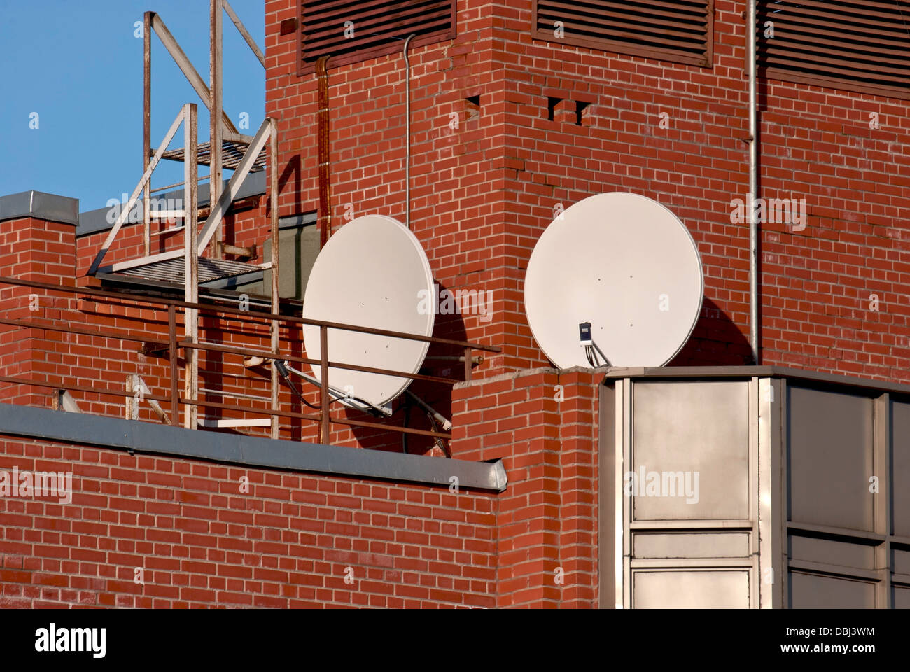 Satellite dishes on the roof of a house. Concept - high technology come ...