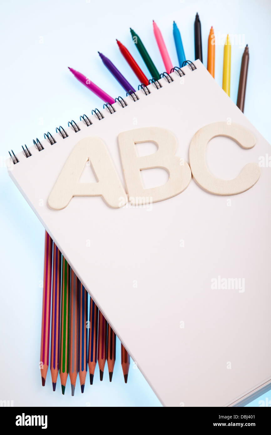 Notepad with school supplies Stock Photo - Alamy