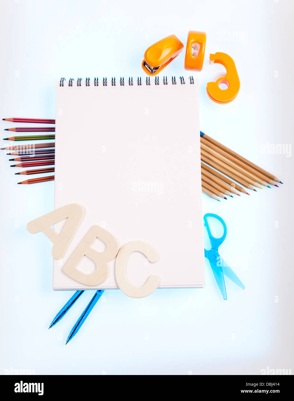 Notepad with school supplies Stock Photo - Alamy