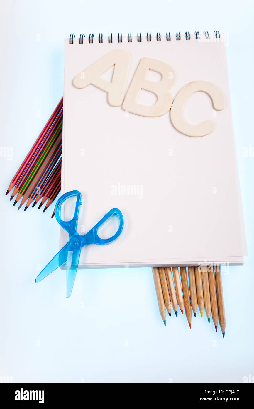 Notepad with school supplies Stock Photo - Alamy