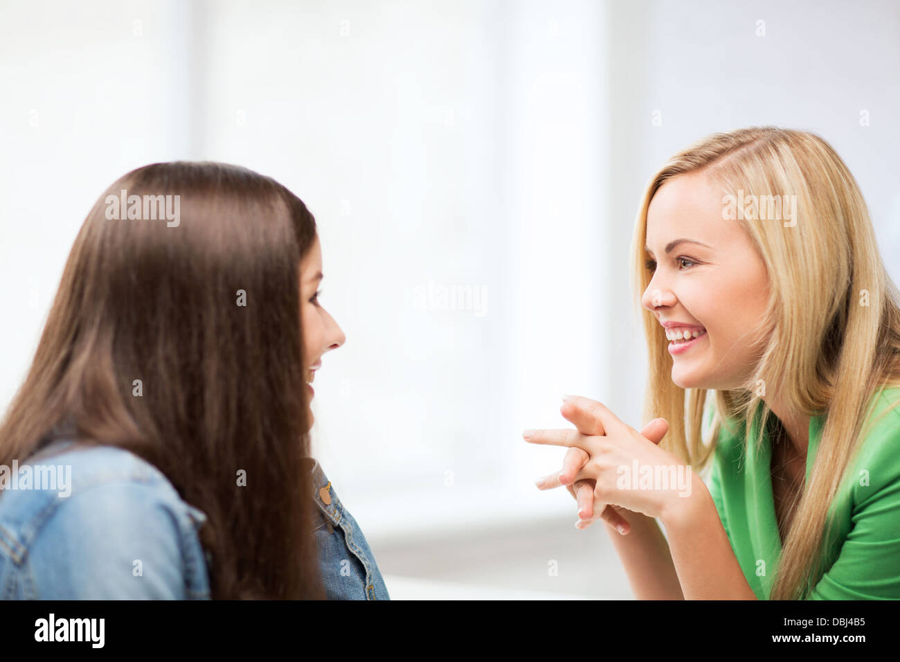 student girls gossiping at school Stock Photo - Alamy