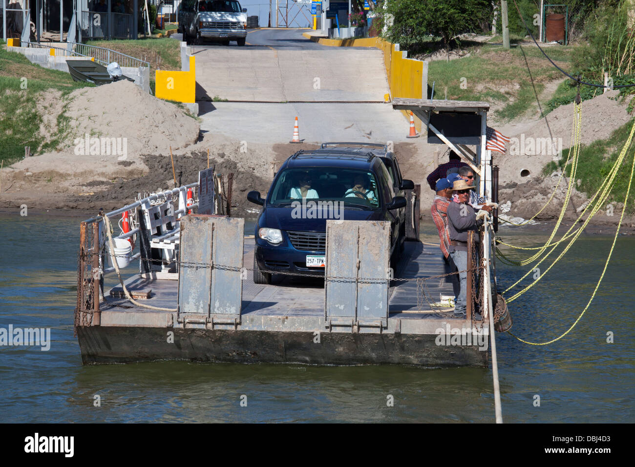 The hand-pulled car ferry which crosses the Rio Grande river between ...