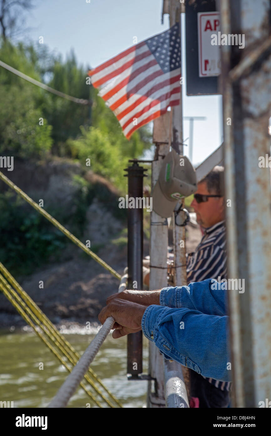 The hand-pulled car ferry which crosses the Rio Grande river between ...