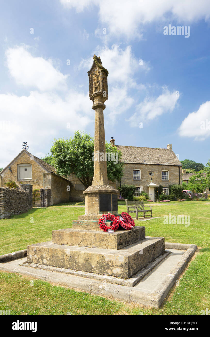 The village green and war memorial in the Cotswold village of Guiting ...