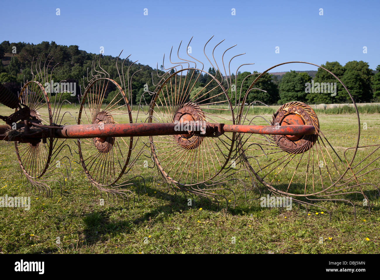 Hay tedder machine & farming landscape near Lary outside Ballater ...