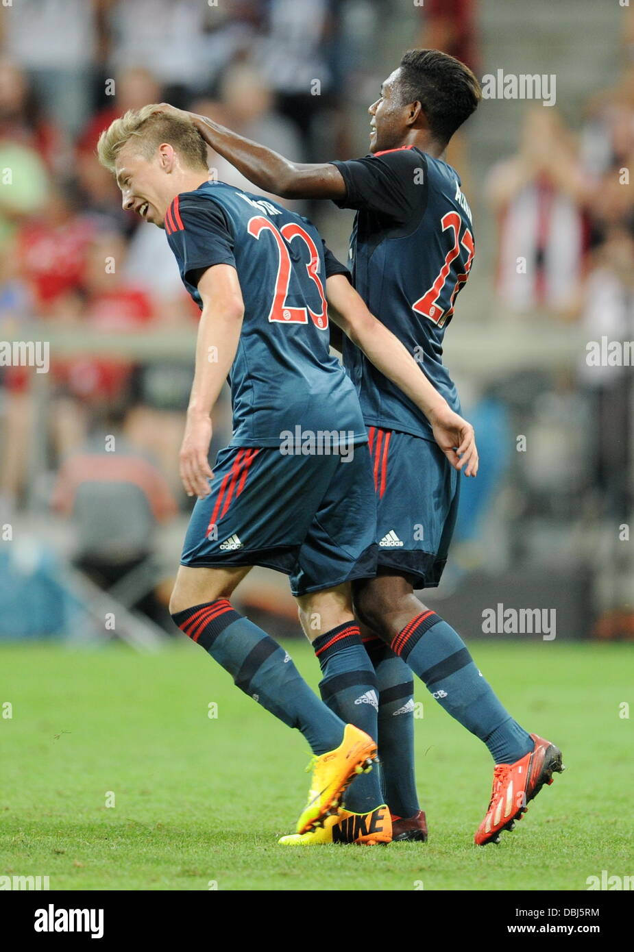 Munich, Germany. 31st July, 2013. Munich's Mitchell Weiser (L ...