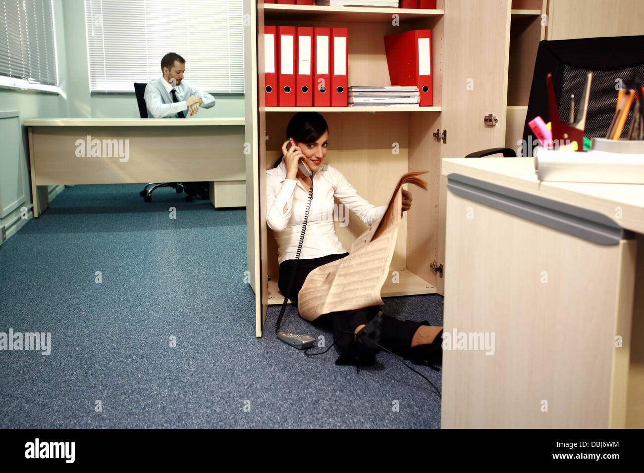 Office worker wasting time phone hi-res stock photography and images ...