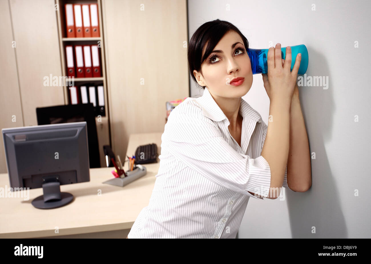 Office worker eavesdropping Stock Photo - Alamy