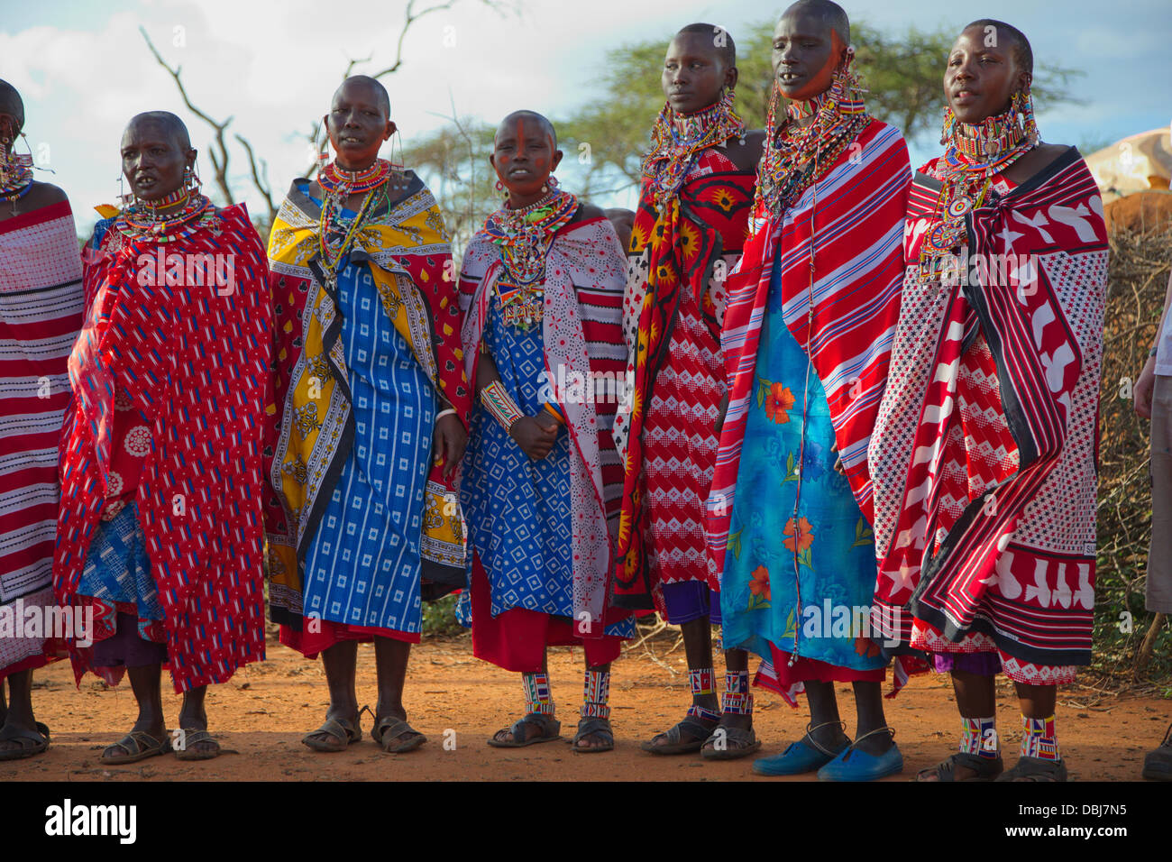 Masai Villagers in traditional clothing outside boma. Ol Kinyei ...