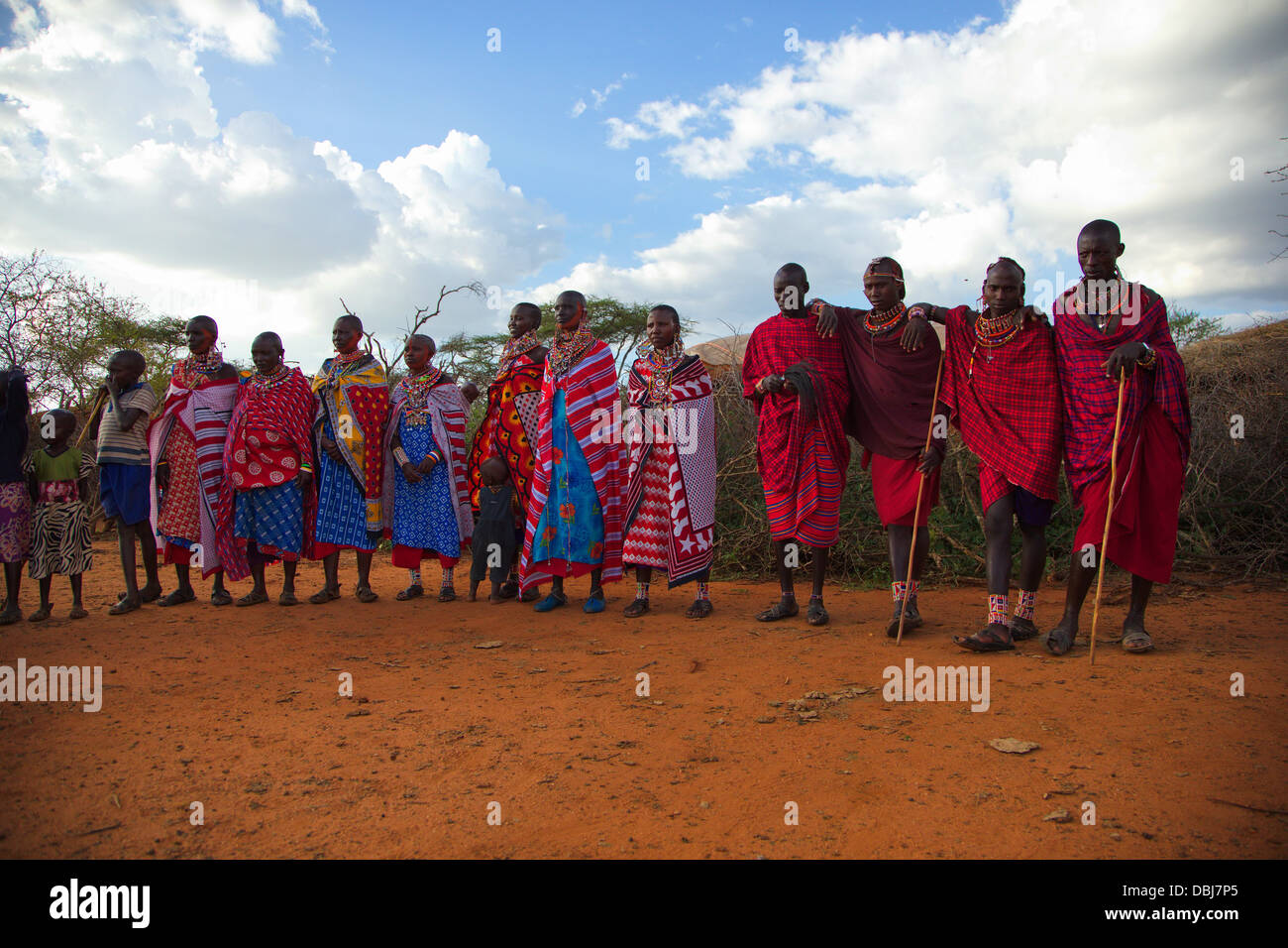 Masai Villagers in traditional clothing outside boma. Selenkay ...