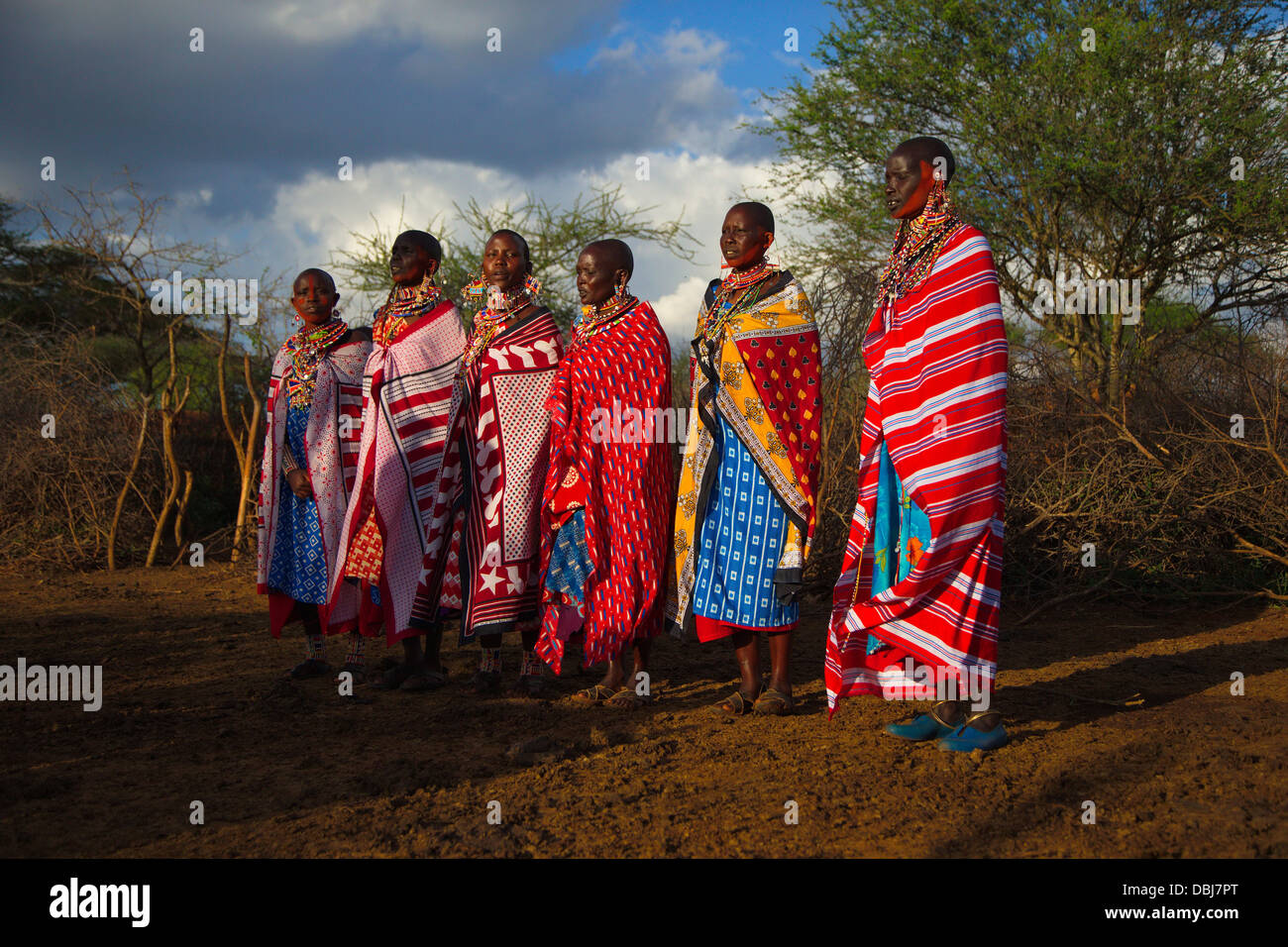 Masai Villagers in traditional clothing outside boma. Selenkay ...