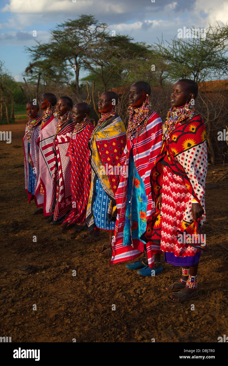 Masai Villagers in traditional clothing outside boma. Selenkay ...