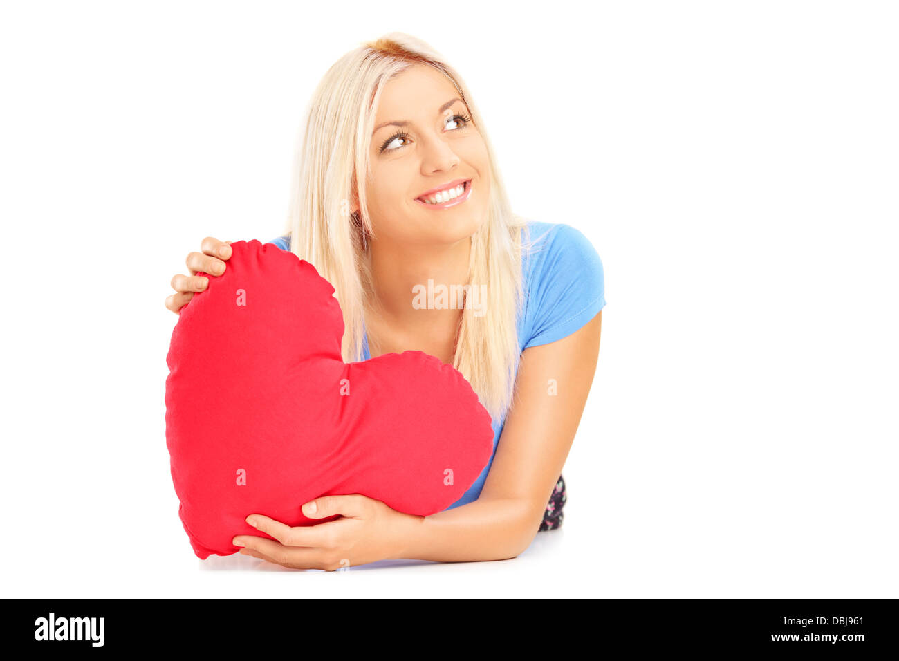Woman smiling holding heart Cut Out Stock Images & Pictures - Alamy