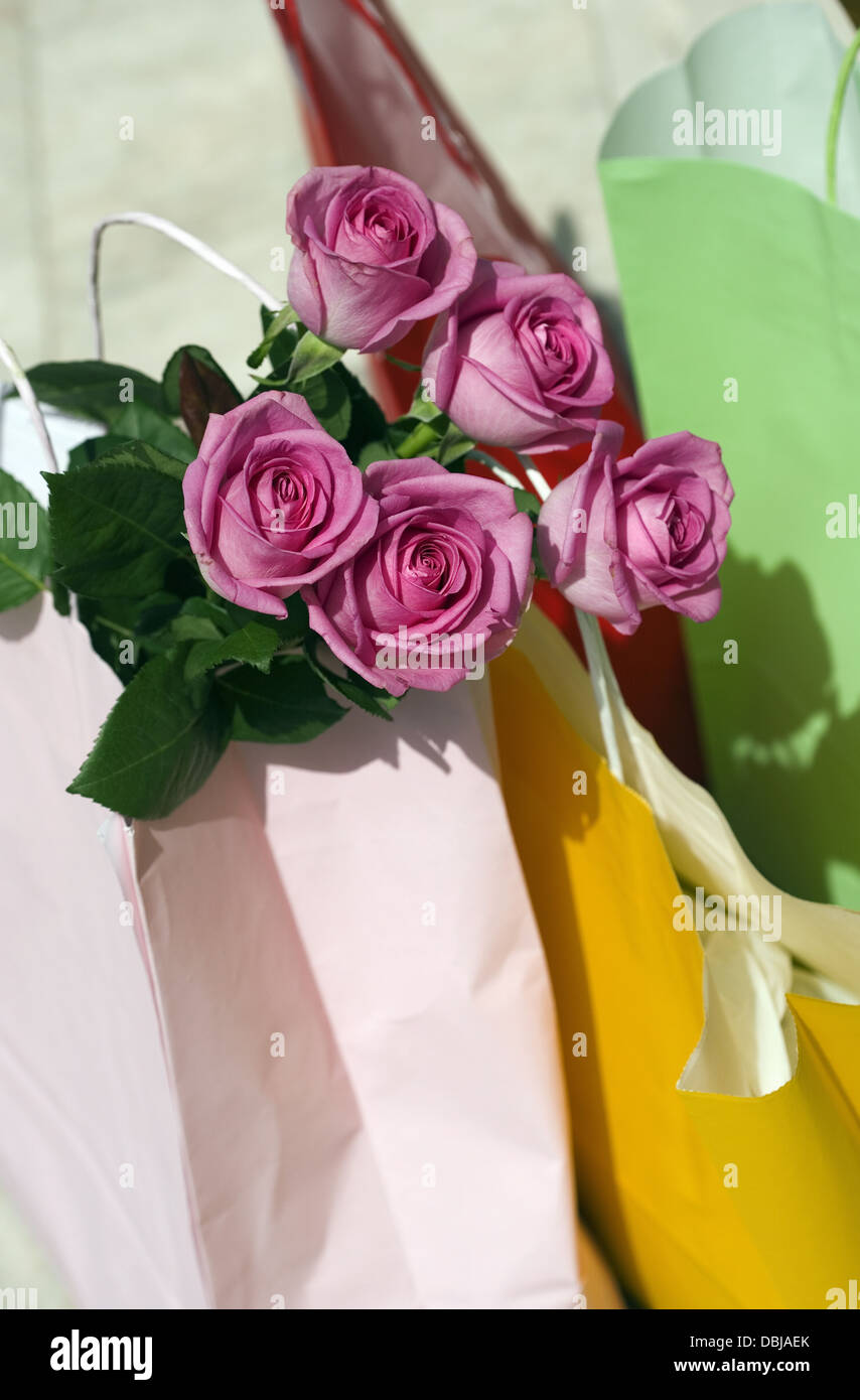 Shopping bags and roses Stock Photo - Alamy