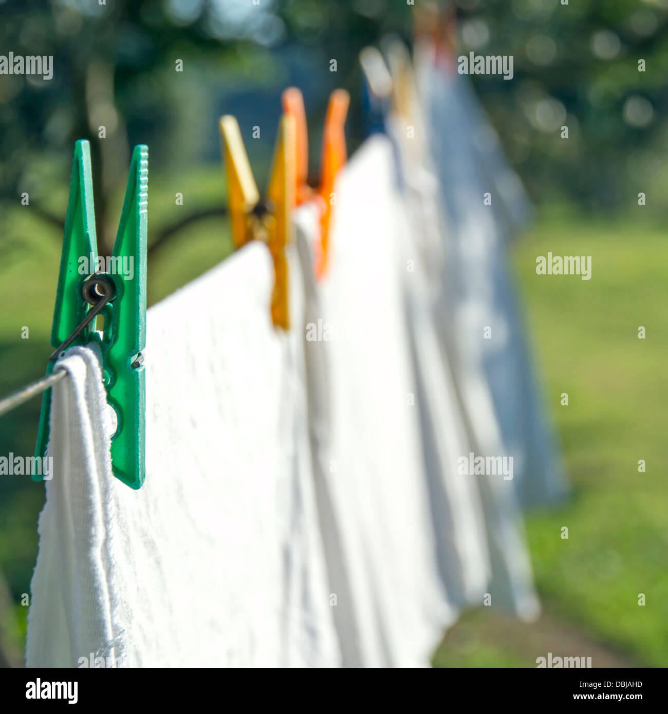 White laundry drying on a clothesline Stock Photo - Alamy